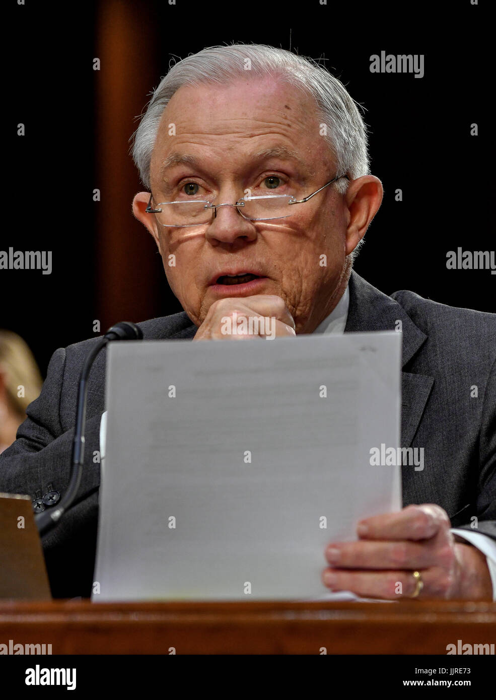 US. Attorney General Jeff Sessions reads from prepared answers in ...