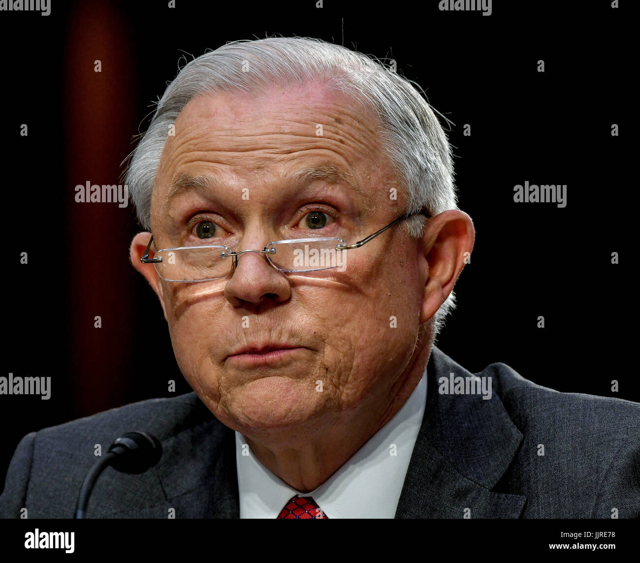 US. Attorney General Jeff Sessions reads from prepared answers in ...