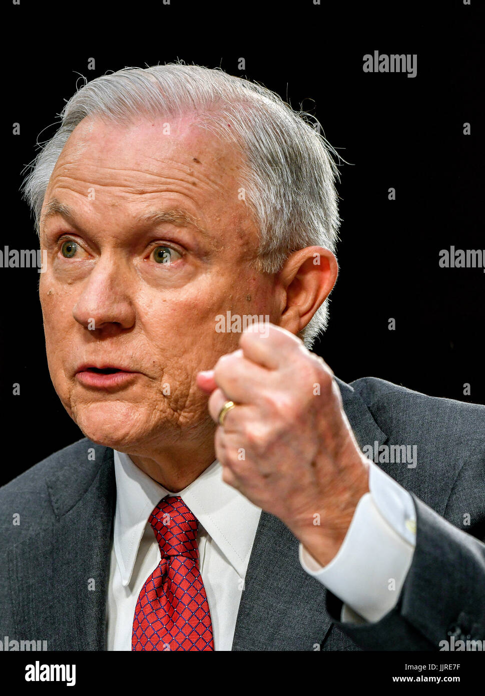 US. Attorney General Jeff Sessions raises his fist to make his point in ...