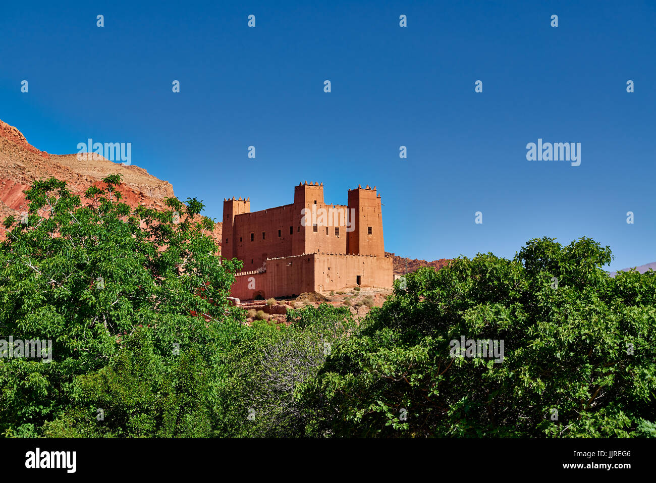 Kasbah in front of spectacular rock landscape of High Atlas mountain ...