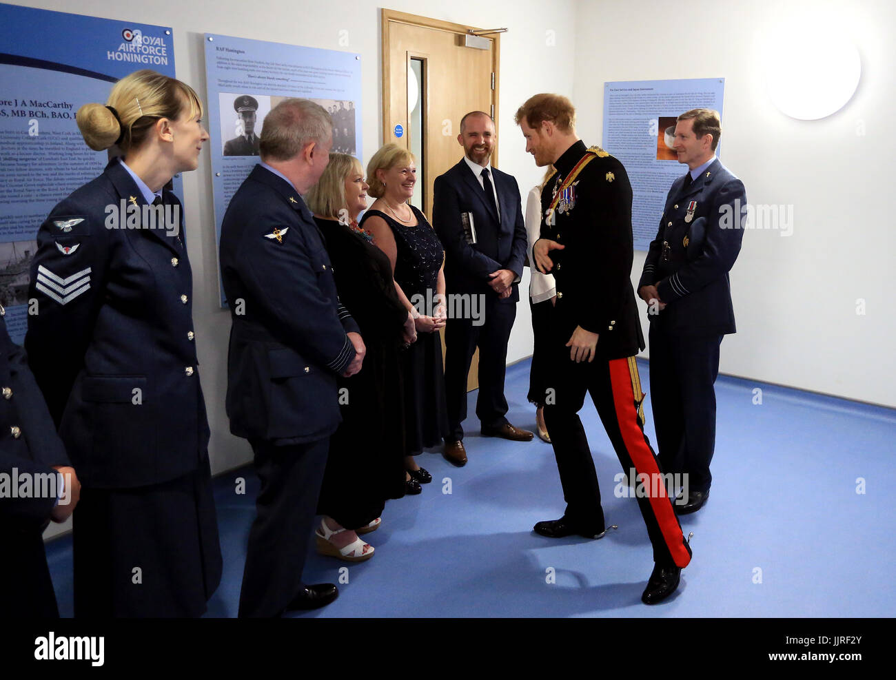 Prince Harry meets guests as he officially opens the Aidan MacCarthy ...