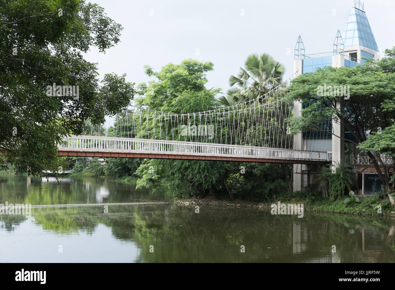 Landscape view of pedestrian suspension bridge or steel hanging ...