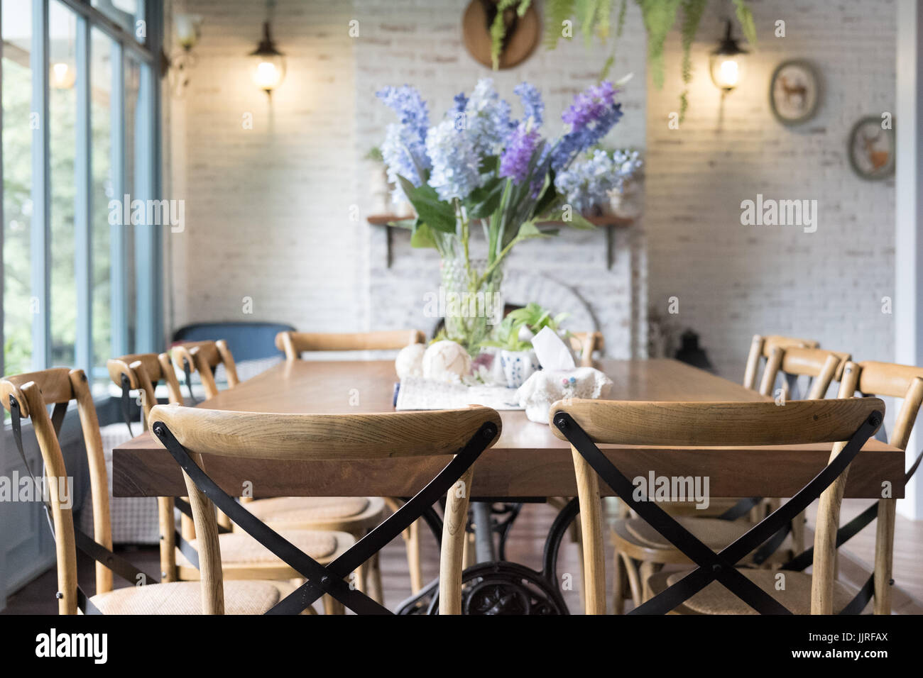 wood table and chair in dining room beside window. modern home interior ...