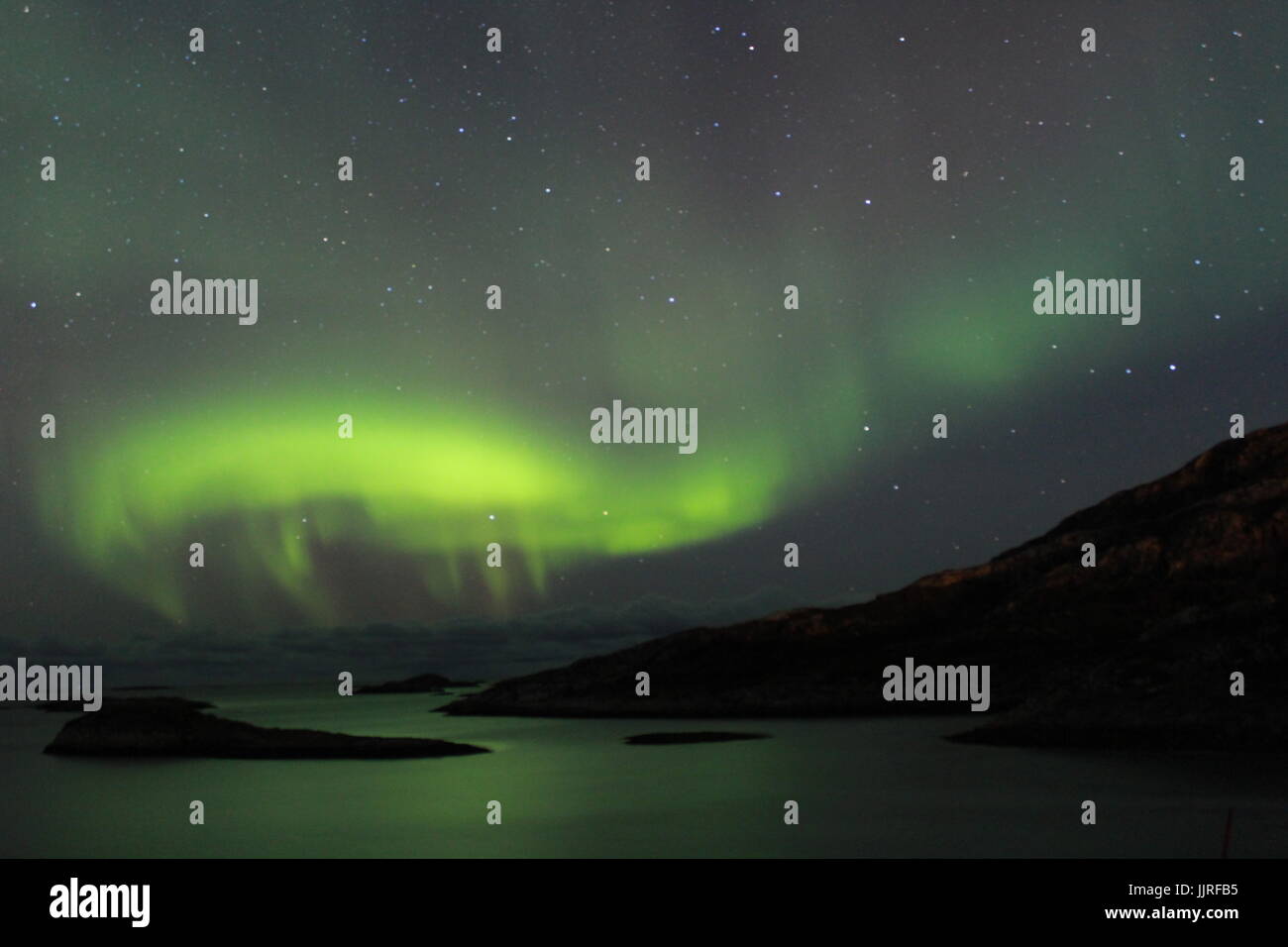 Northern lights over the Fjords in Tromso Stock Photo - Alamy