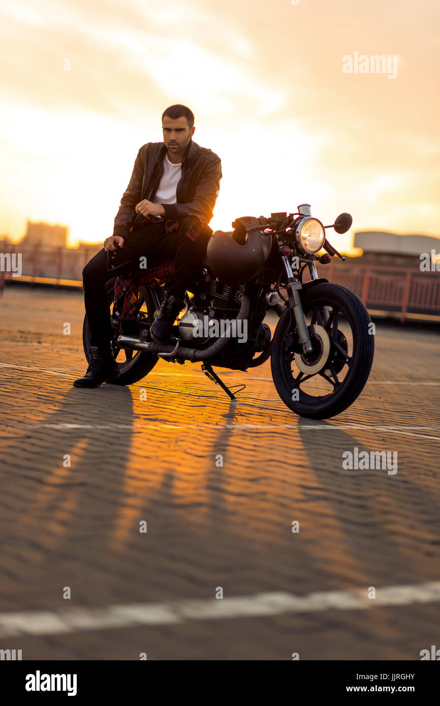 Handsome rider man with beard and mustache in black leather biker ...
