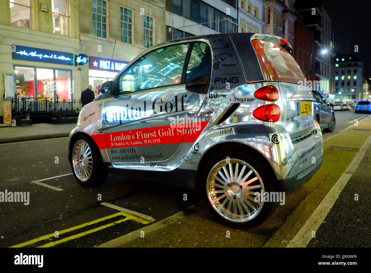 Silevr Smart Car parked in London with Capital Golf Store advertising ...