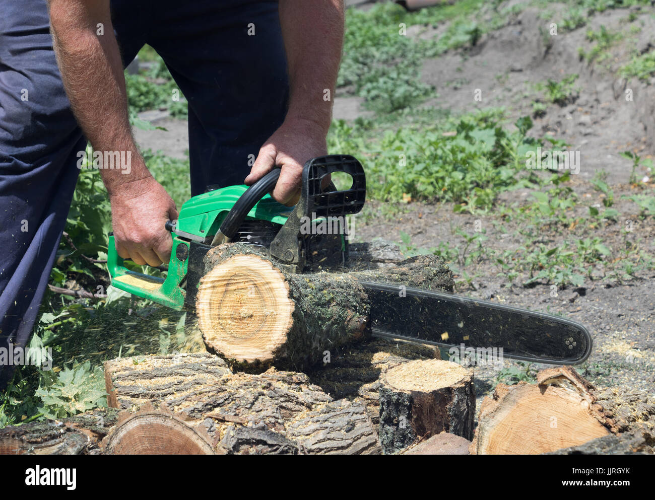Chainsaw in male hands Stock Photo - Alamy