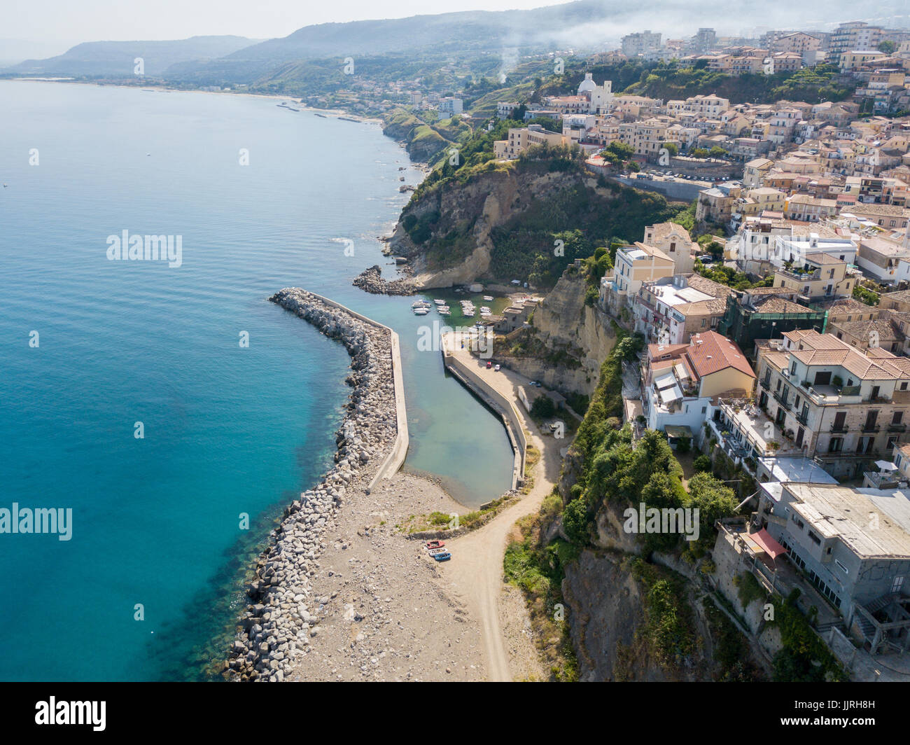 Aerial view of a pier with rocks and rocks on the sea. Pier of Pizzo ...