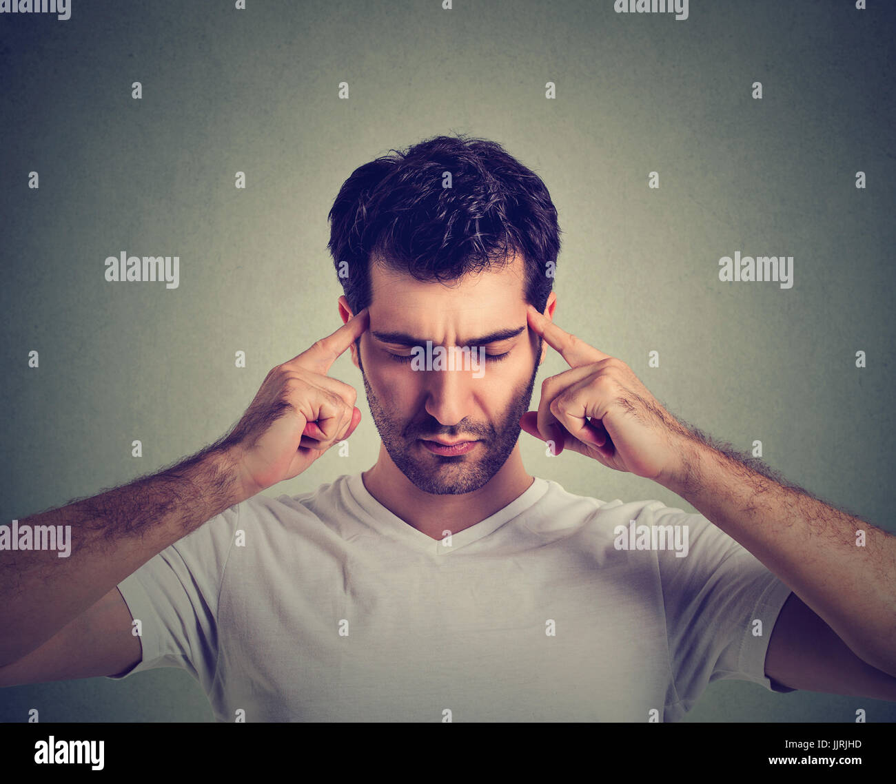 Thoughtful sad young man thinking very intensely concentrating Stock ...