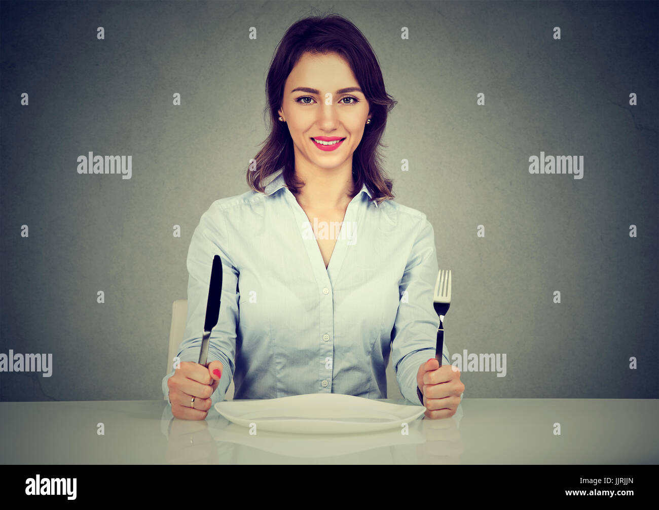 Hungry woman empty plate hi-res stock photography and images - Alamy