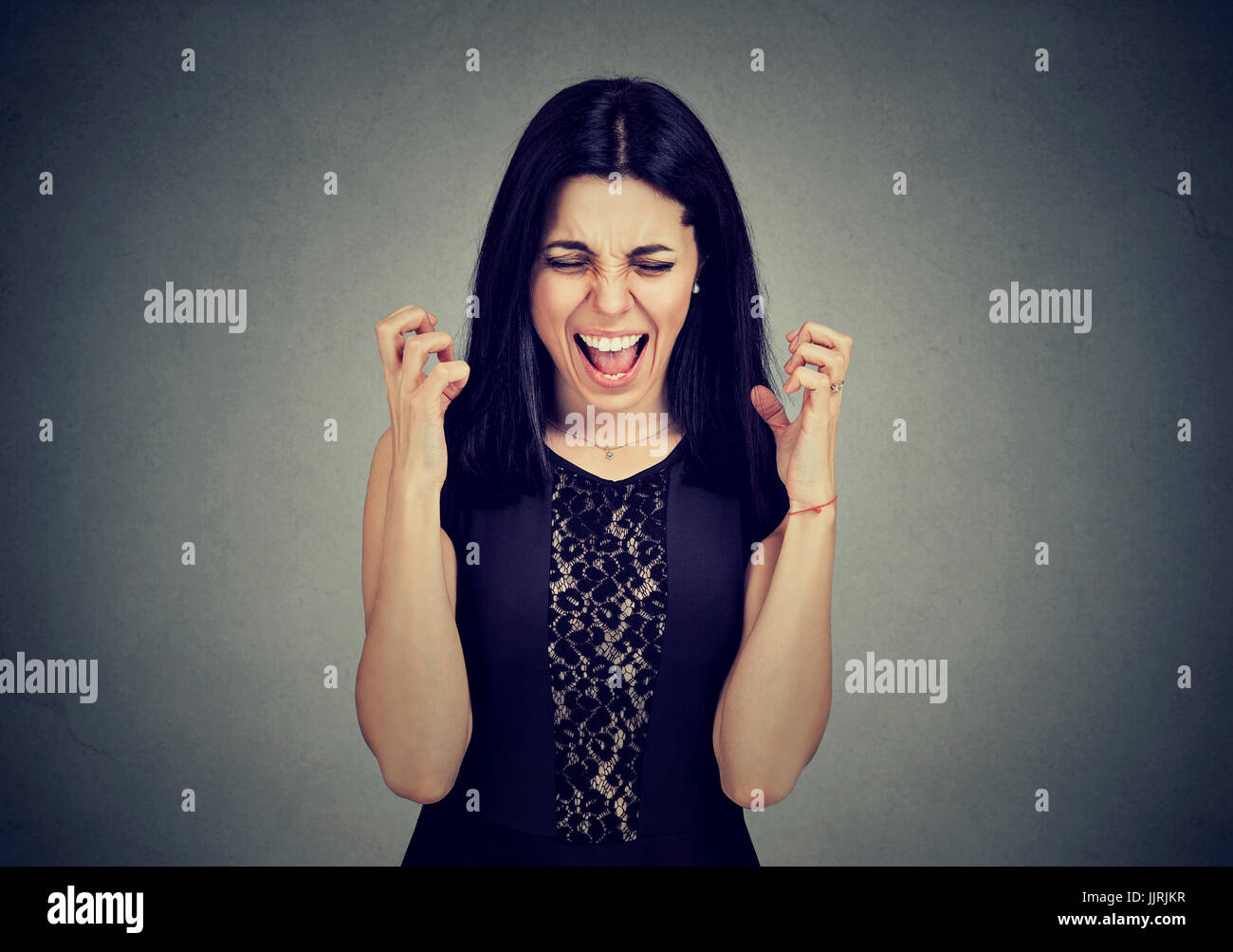 Angry hysterical young woman screaming Stock Photo - Alamy