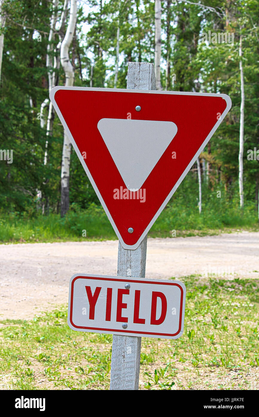 A yield sign with the written word below it Stock Photo - Alamy