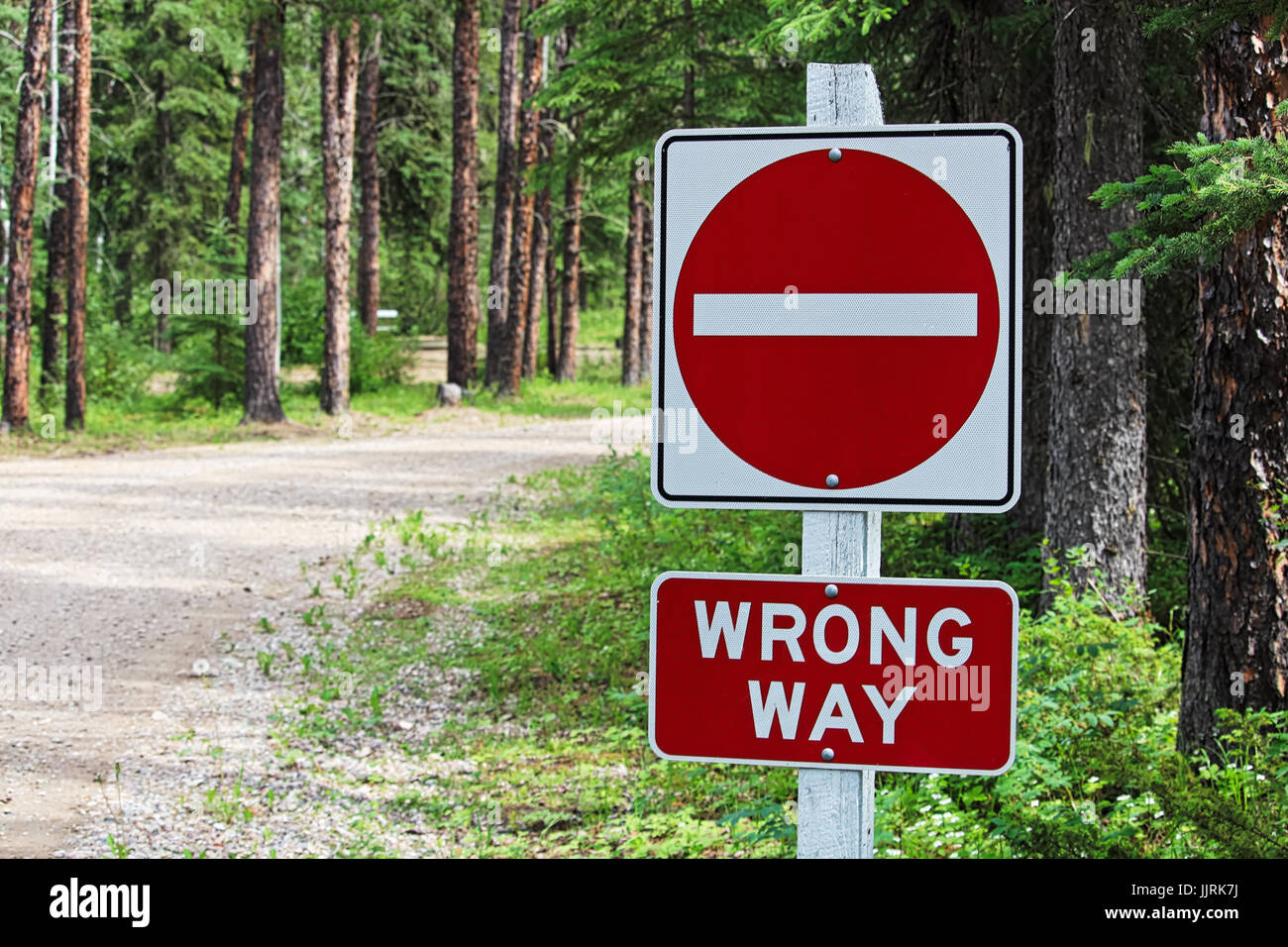A do not enter, wrong way sign beside a gravel road Stock Photo - Alamy