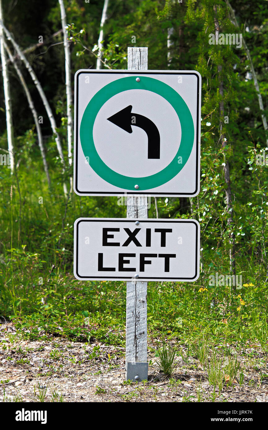 A turning sign with exit left written below it Stock Photo - Alamy