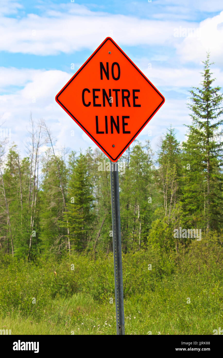 A no centre line sign with trees in the background Stock Photo - Alamy