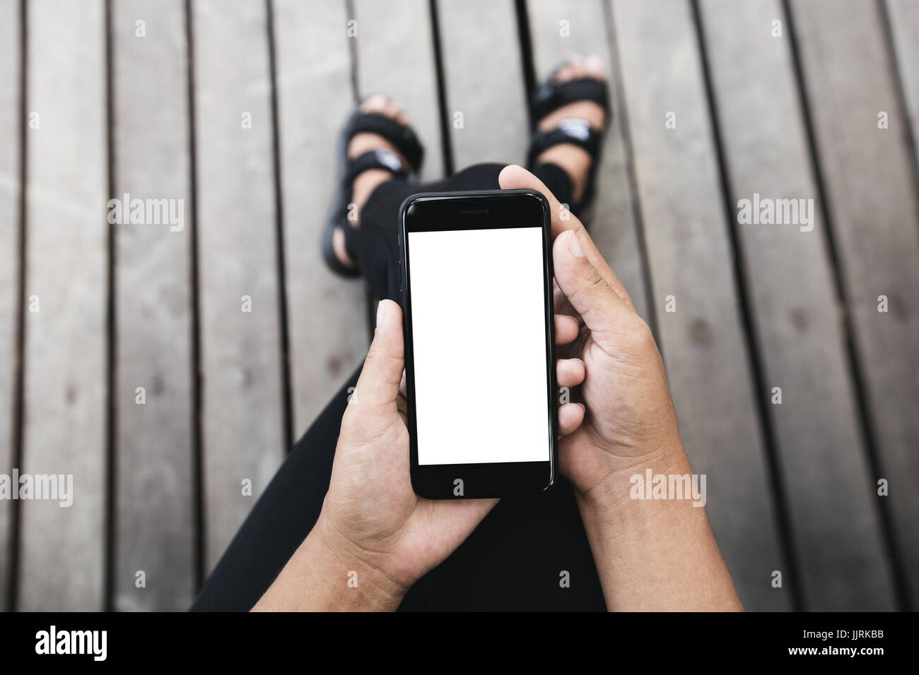 woman sitting and using phone outdoor lifestyle Stock Photo - Alamy