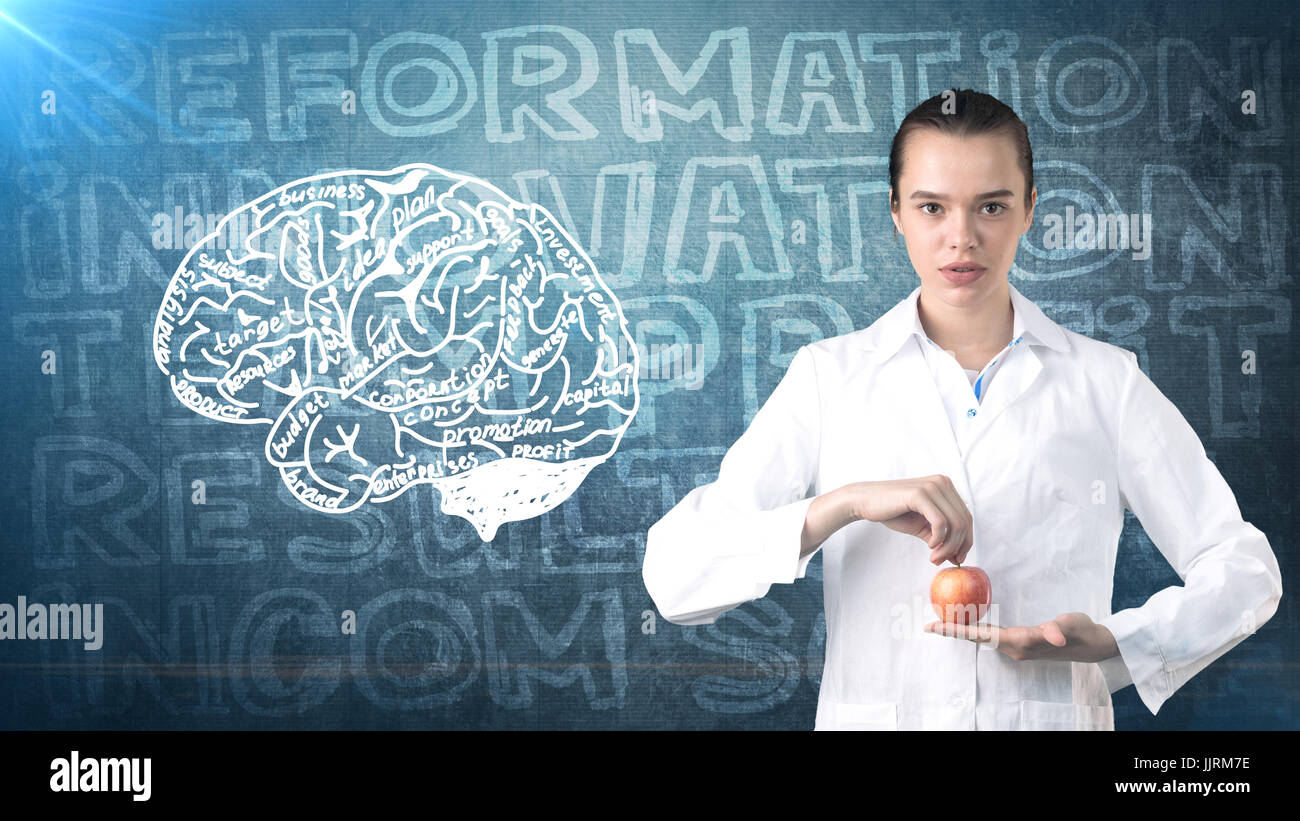 Beautiful medical woman doctor in uniform. Studio painted background ...