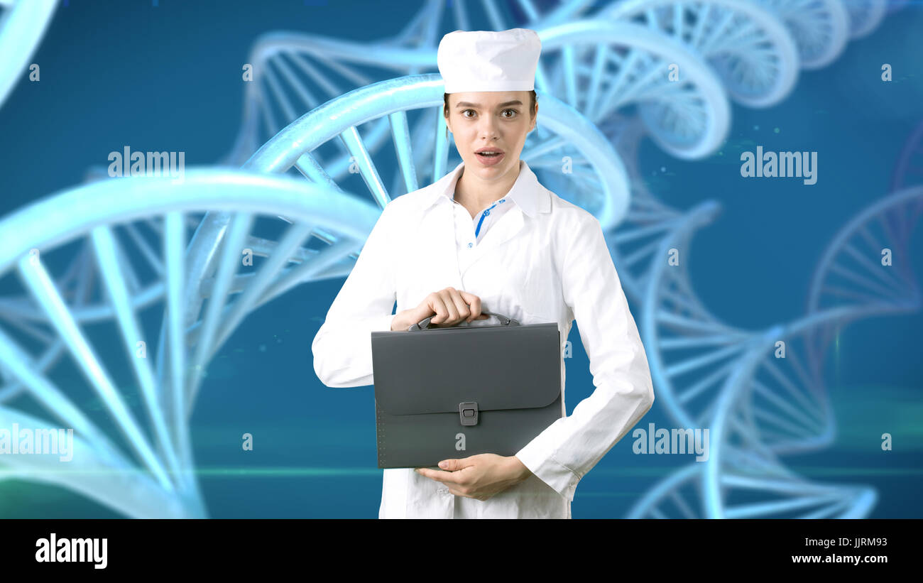 Beautiful medical woman doctor in uniform. Studio painted background ...