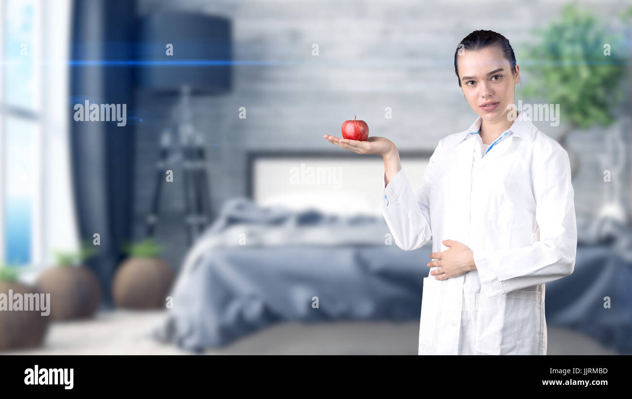 Beautiful medical woman doctor in uniform. Studio painted background ...