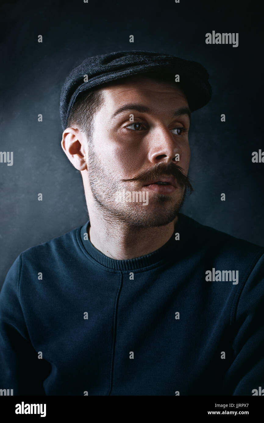 The young man in cap at studio Stock Photo - Alamy