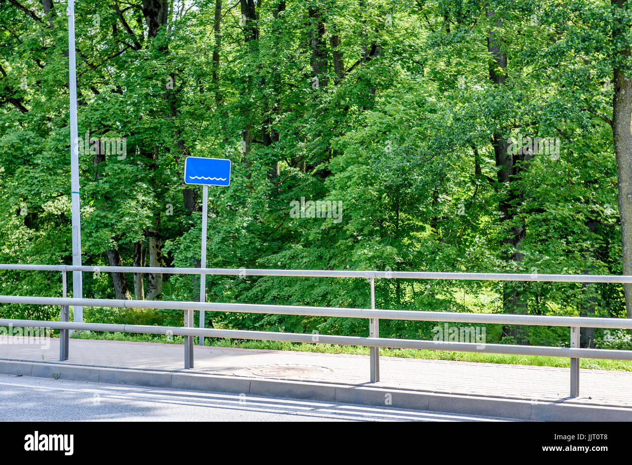 road signs and lines on asphalt in summer Stock Photo - Alamy