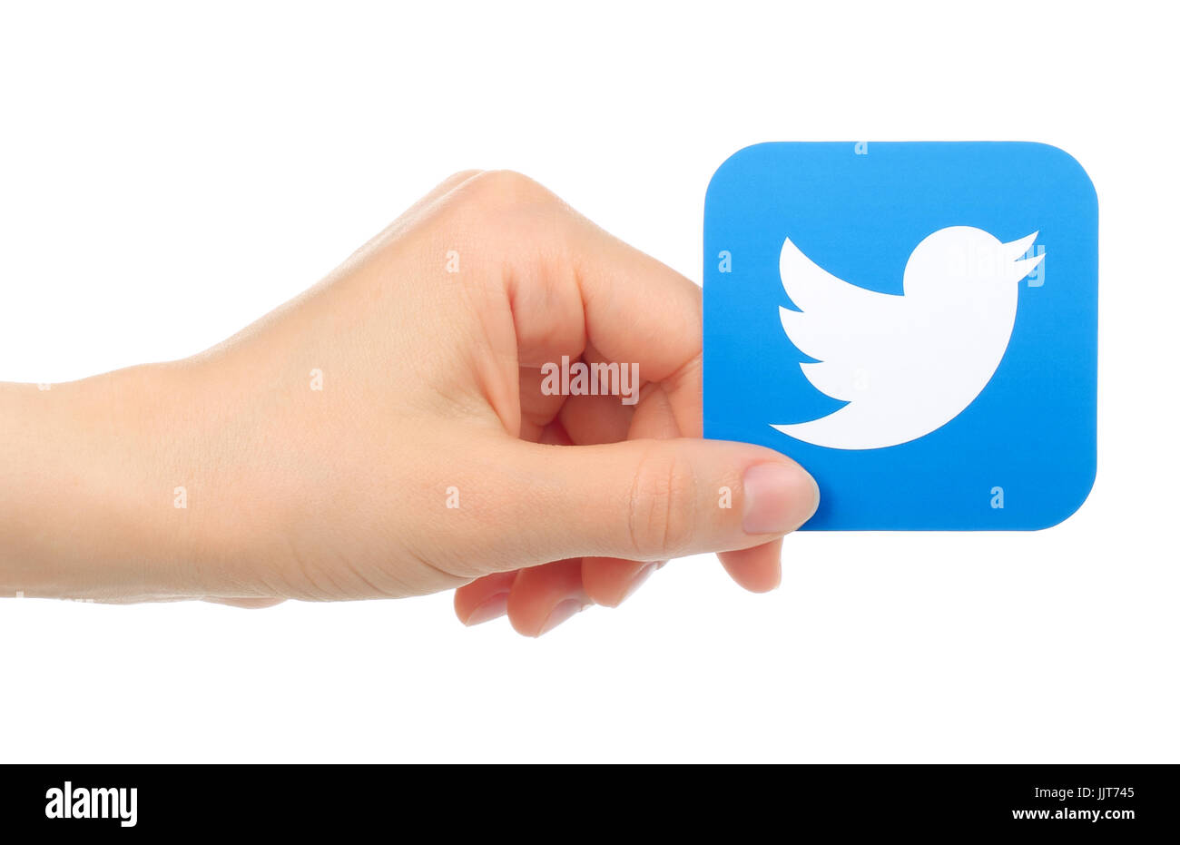 Kiev, Ukraine - May 17, 2016: Hand holds Twitter icon printed on paper ...