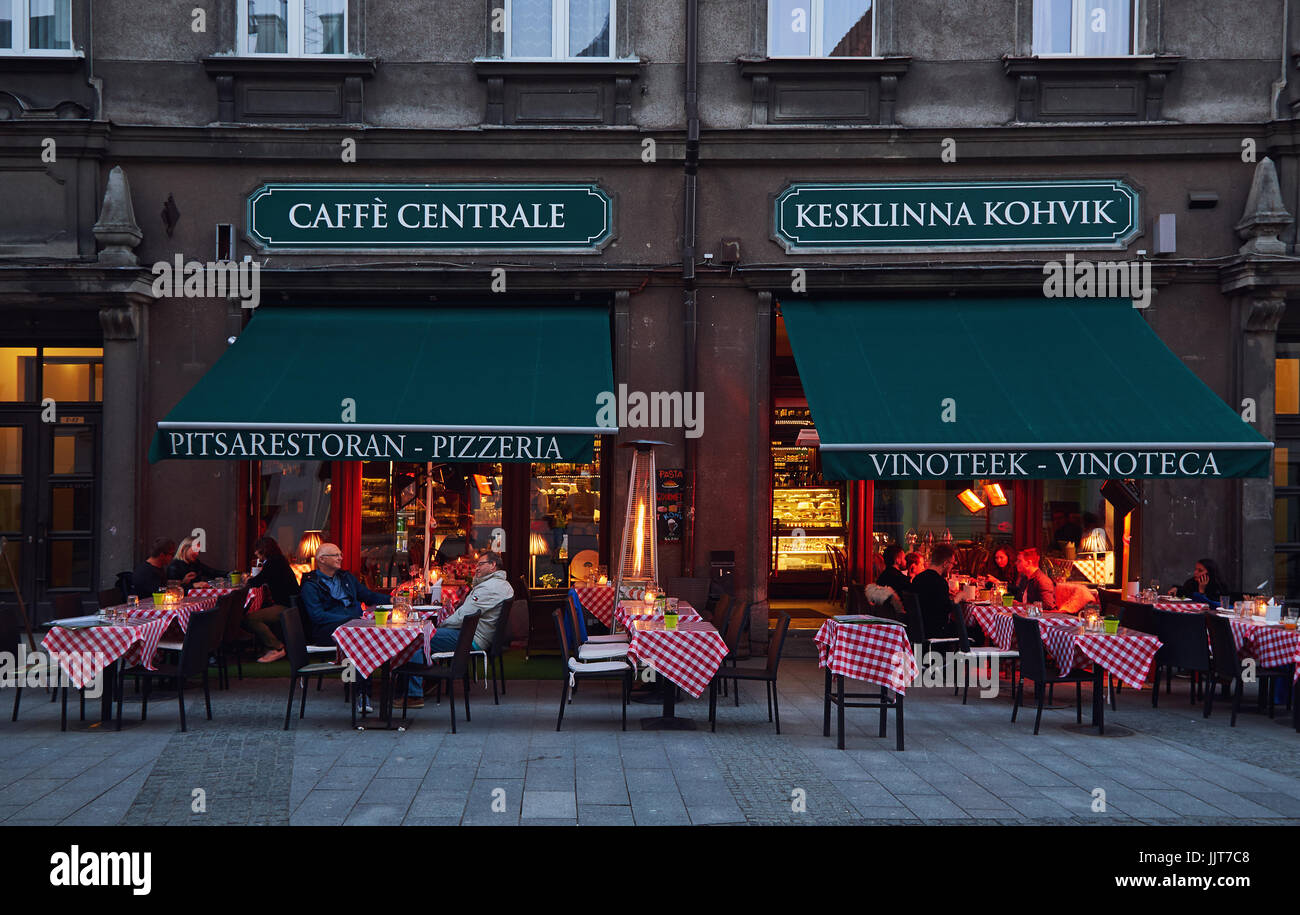 Tallinn cafe in the evening with visitors and interesting illumination ...