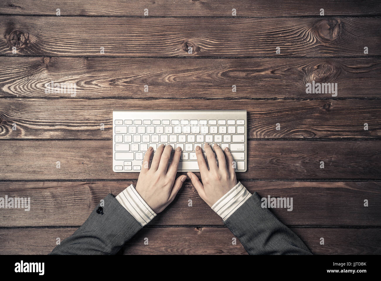 Top view of woman sitting at table with hands folded Stock Photo - Alamy