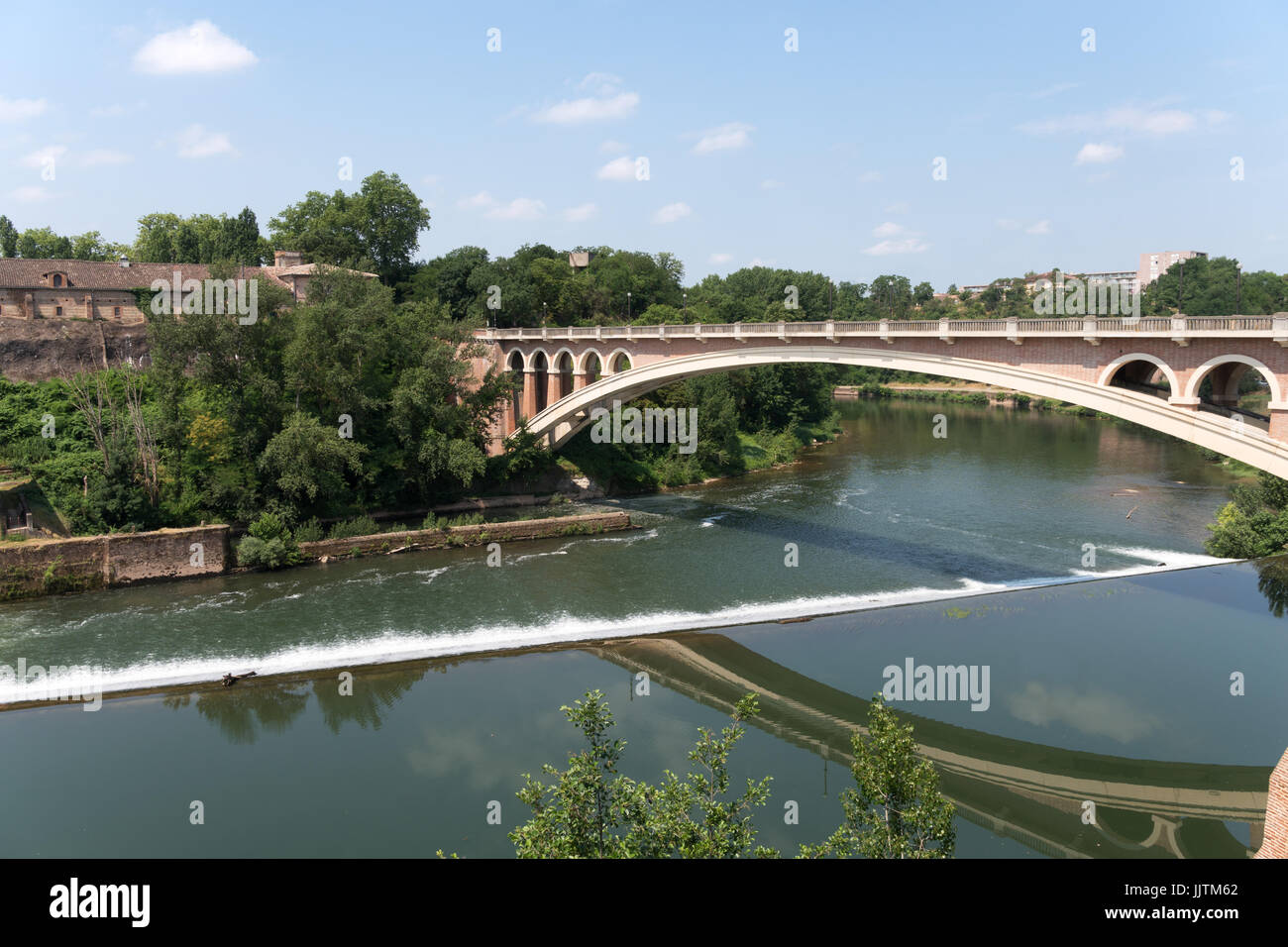Pont Saint-Michel Bridge and weir over the river Tarn with a canal lock ...