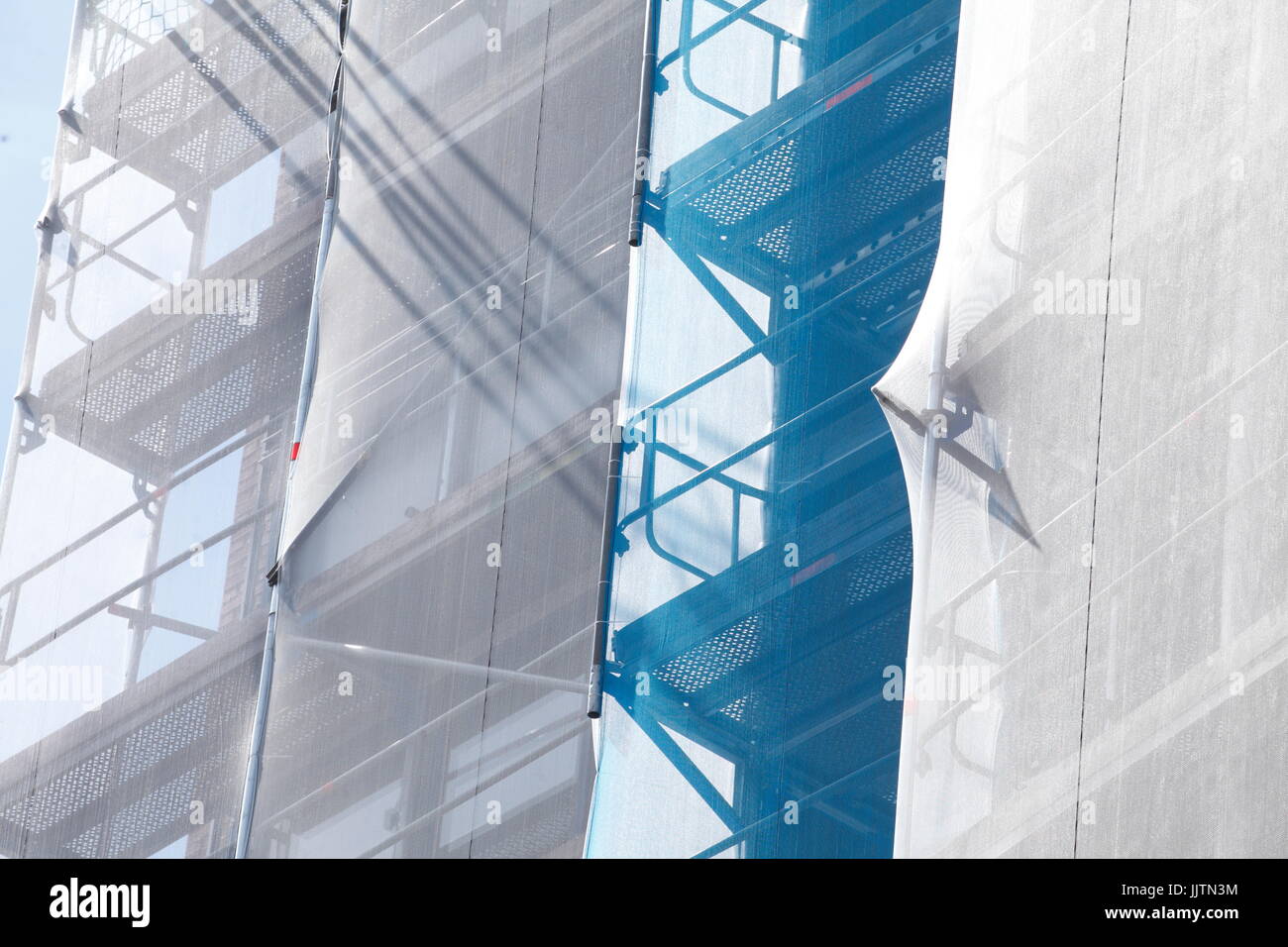 scaffold and Cover tarpaulin on a Construction Site Stock Photo - Alamy