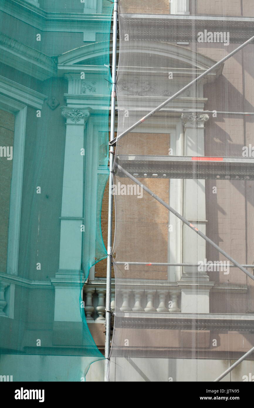 scaffold and Cover tarpaulin and Window on a Construction Site Stock ...