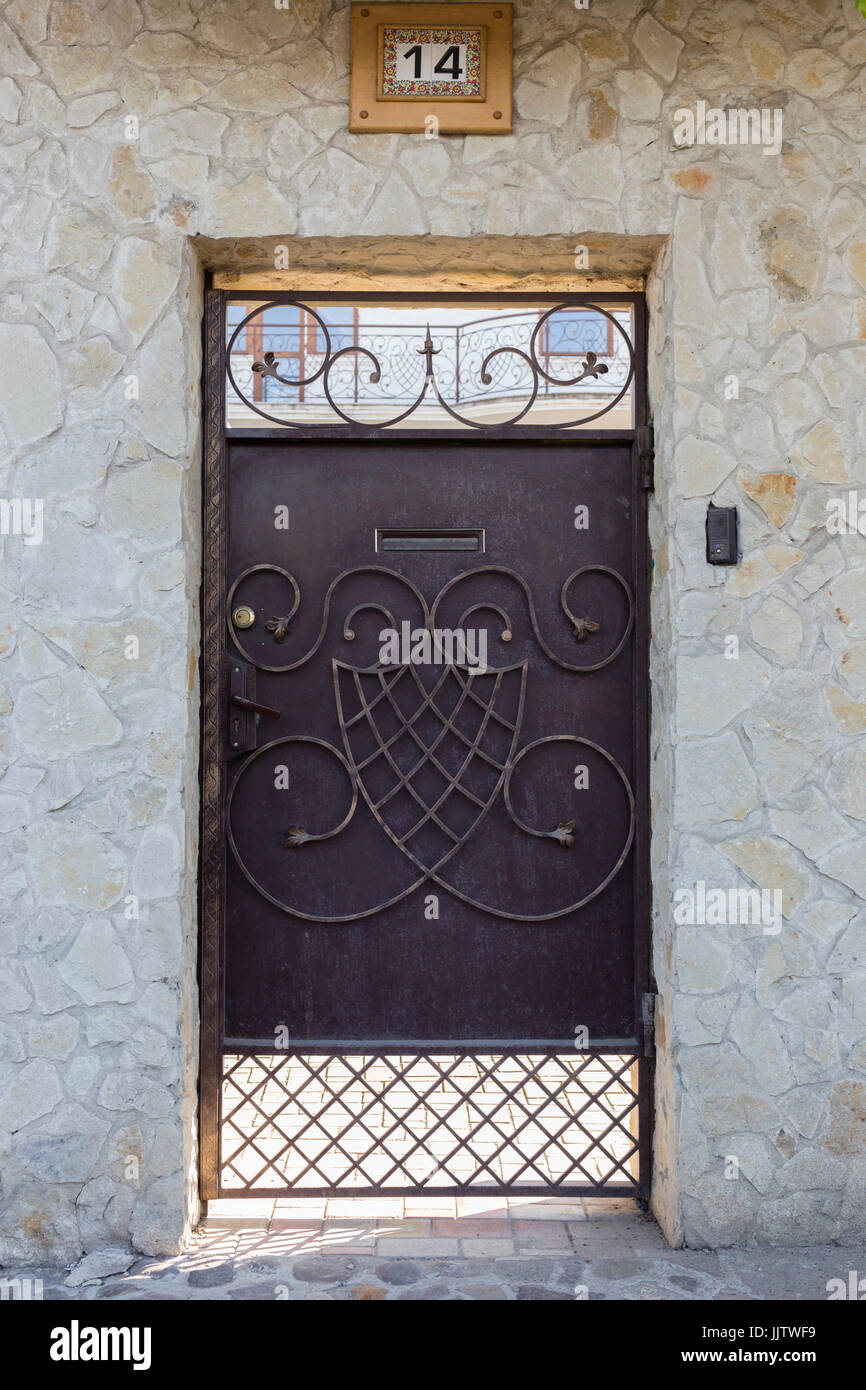 Beautiful metal door. The gateway to an yard Stock Photo - Alamy