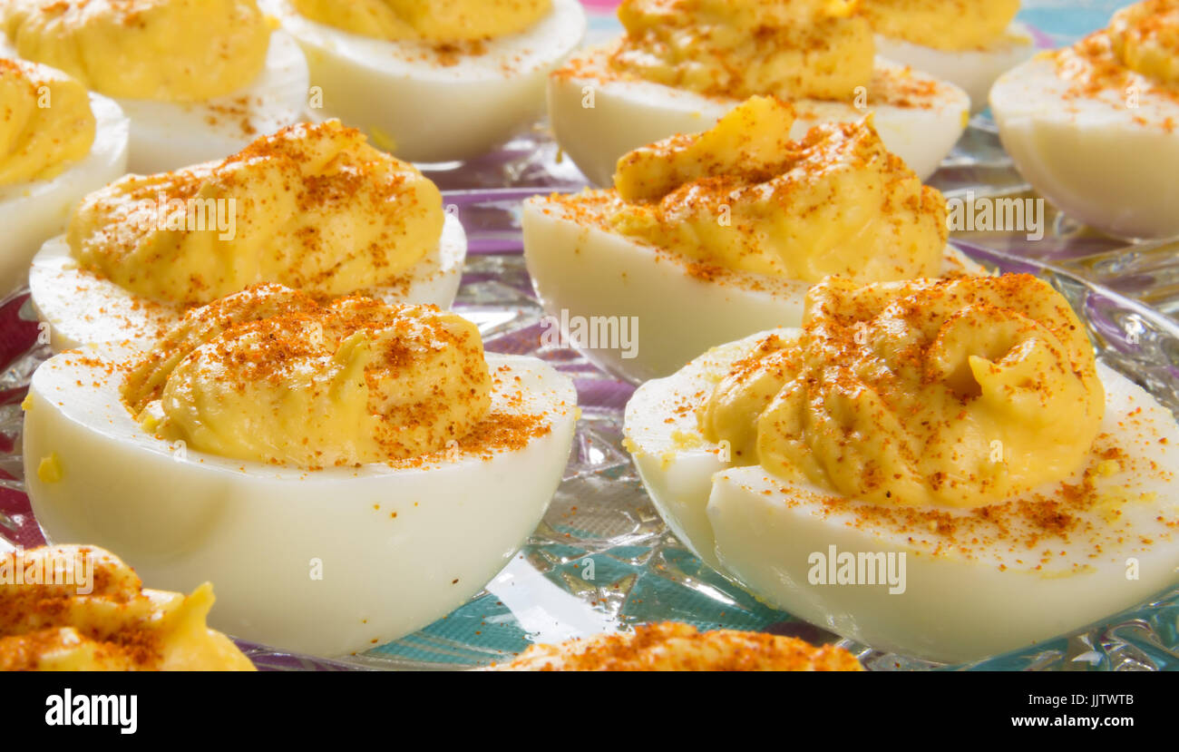 Several delicious Deviled Eggs topped with paprika Stock Photo - Alamy