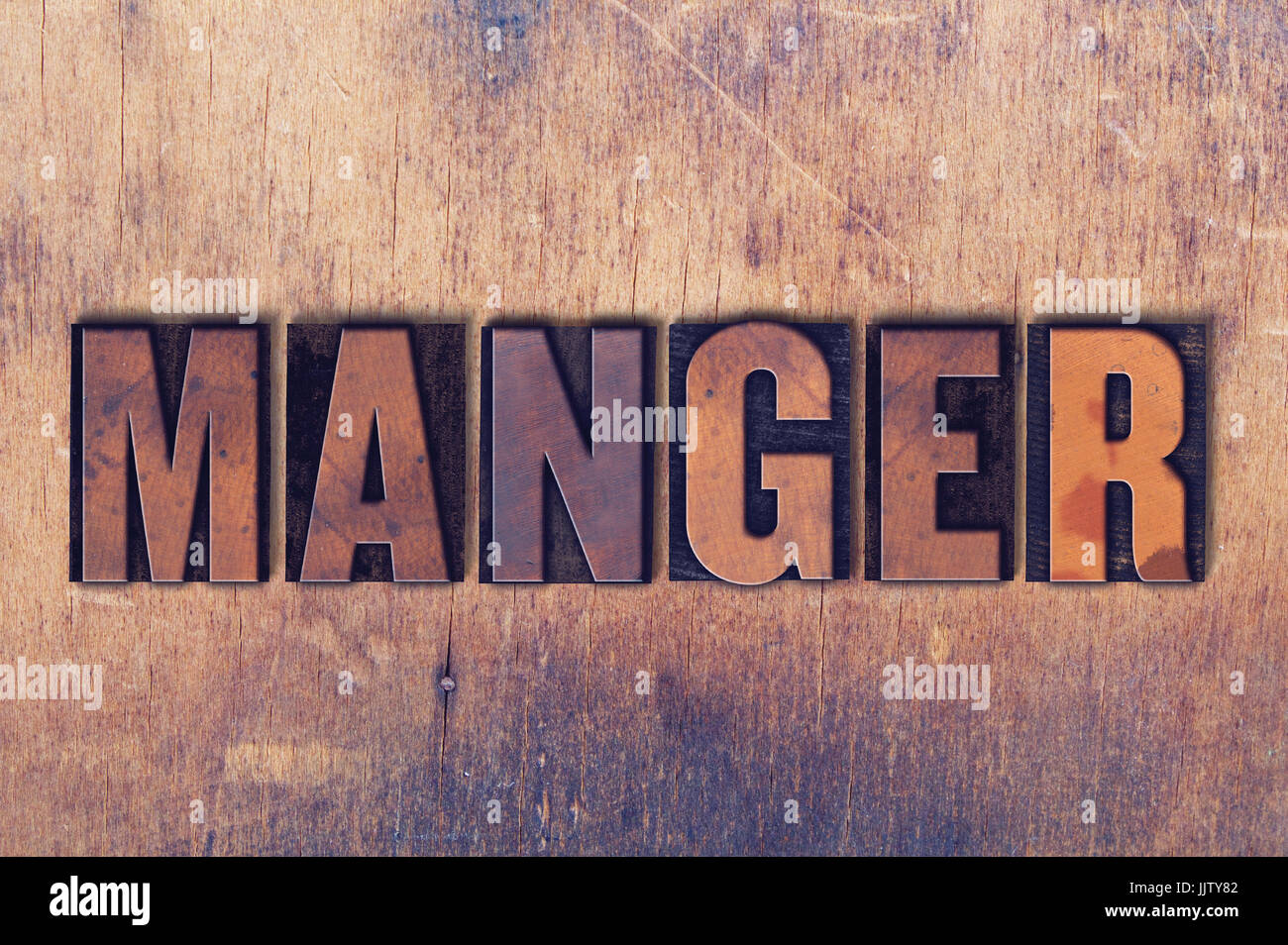 The word Manger concept and theme written in vintage wooden letterpress ...