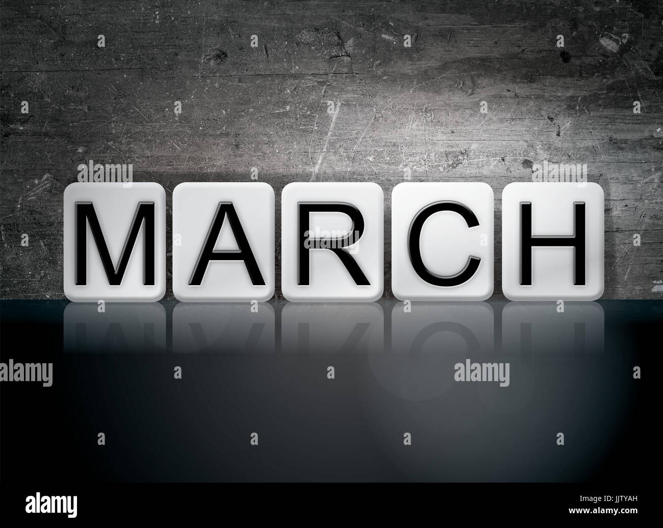 The word March concept and theme written in white tiles on a dark ...