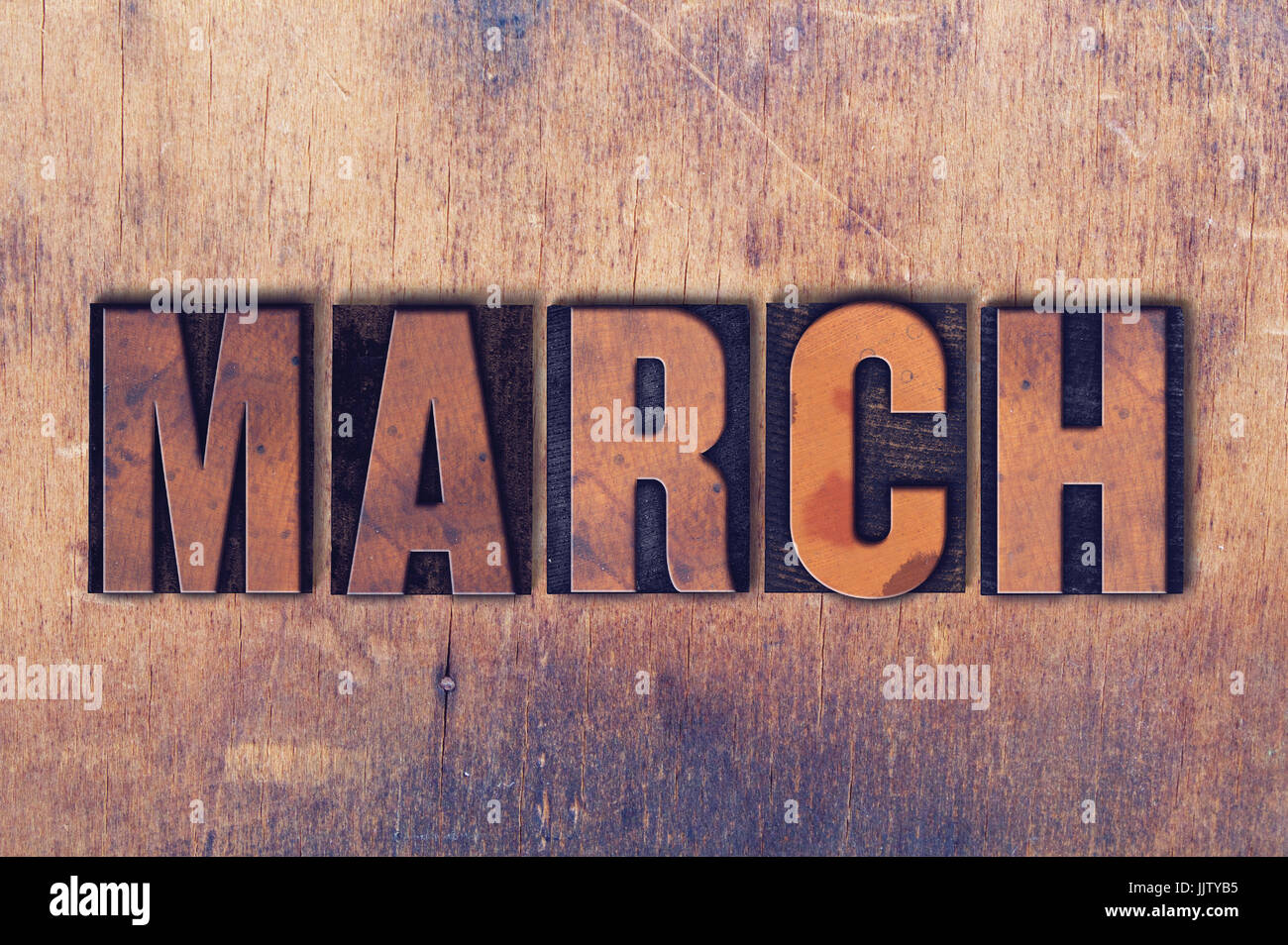 The word March concept and theme written in vintage wooden letterpress ...