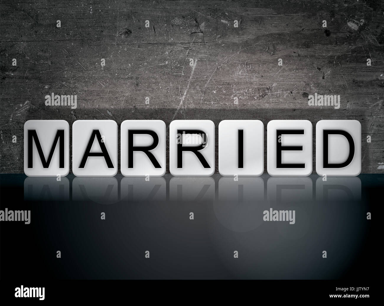 The word Married concept and theme written in white tiles on a dark ...