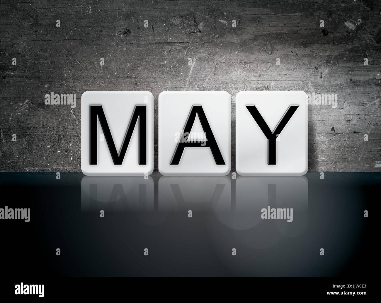 The word May concept and theme written in white tiles on a dark ...