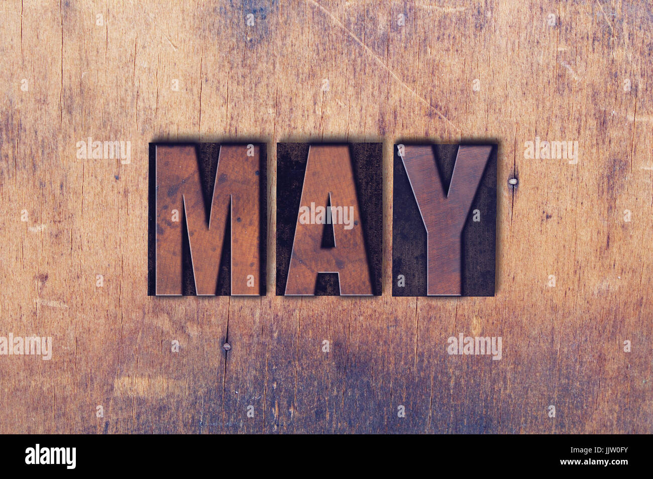 The word May concept and theme written in vintage wooden letterpress ...