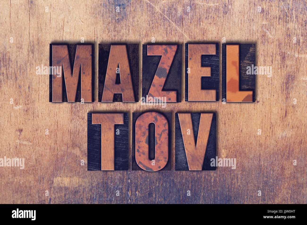The words Mazel Tov concept and theme written in vintage wooden ...