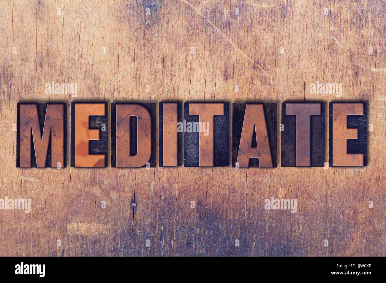 The word Meditate concept and theme written in vintage wooden ...