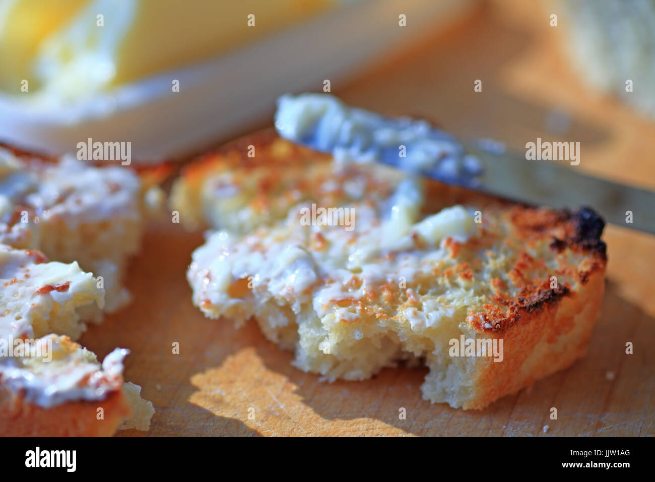 Buttering bread hi-res stock photography and images - Alamy