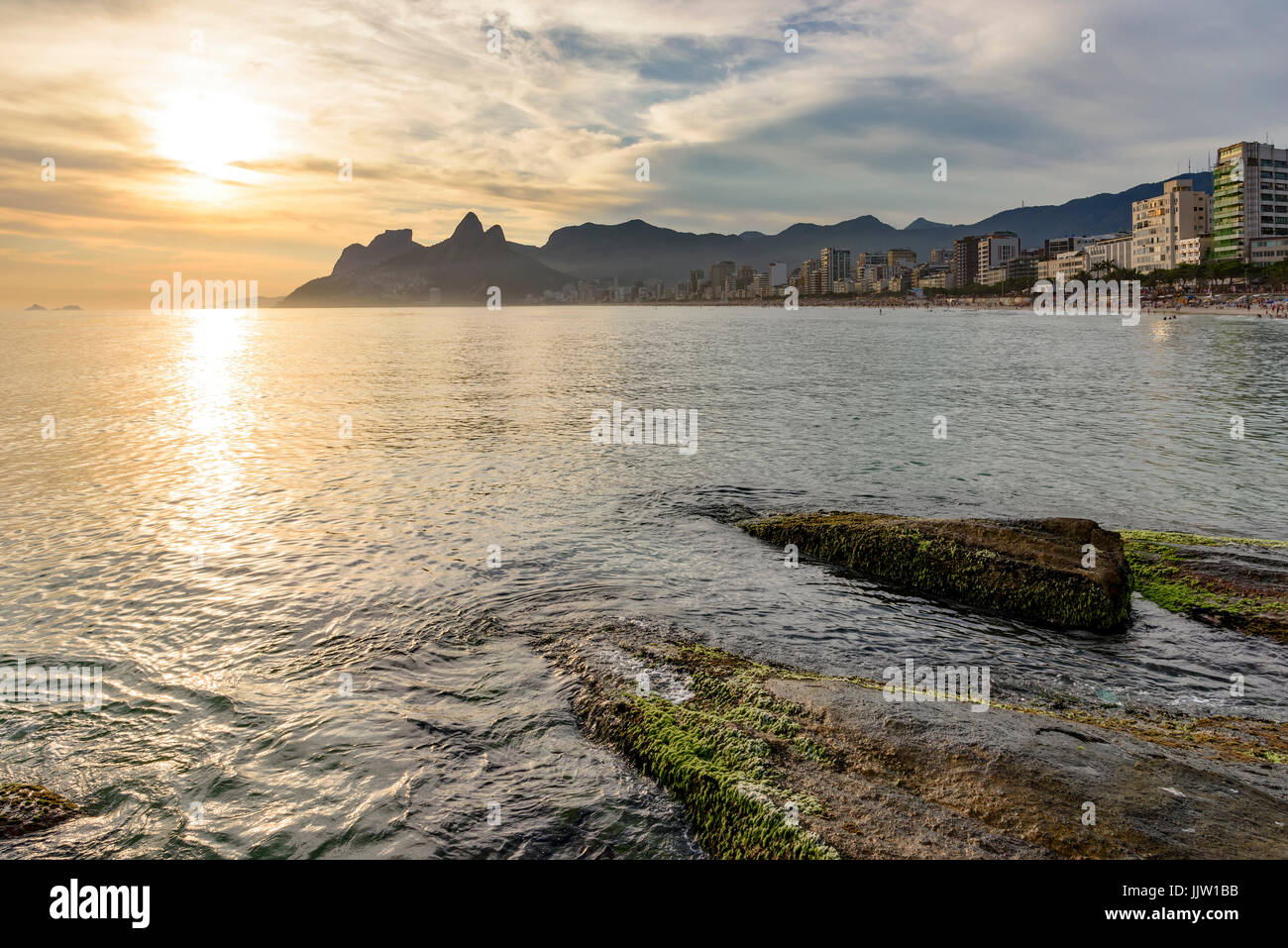 Summer sunset at Ipanema beach in Rio de Janeiro with Two Brothers hill ...