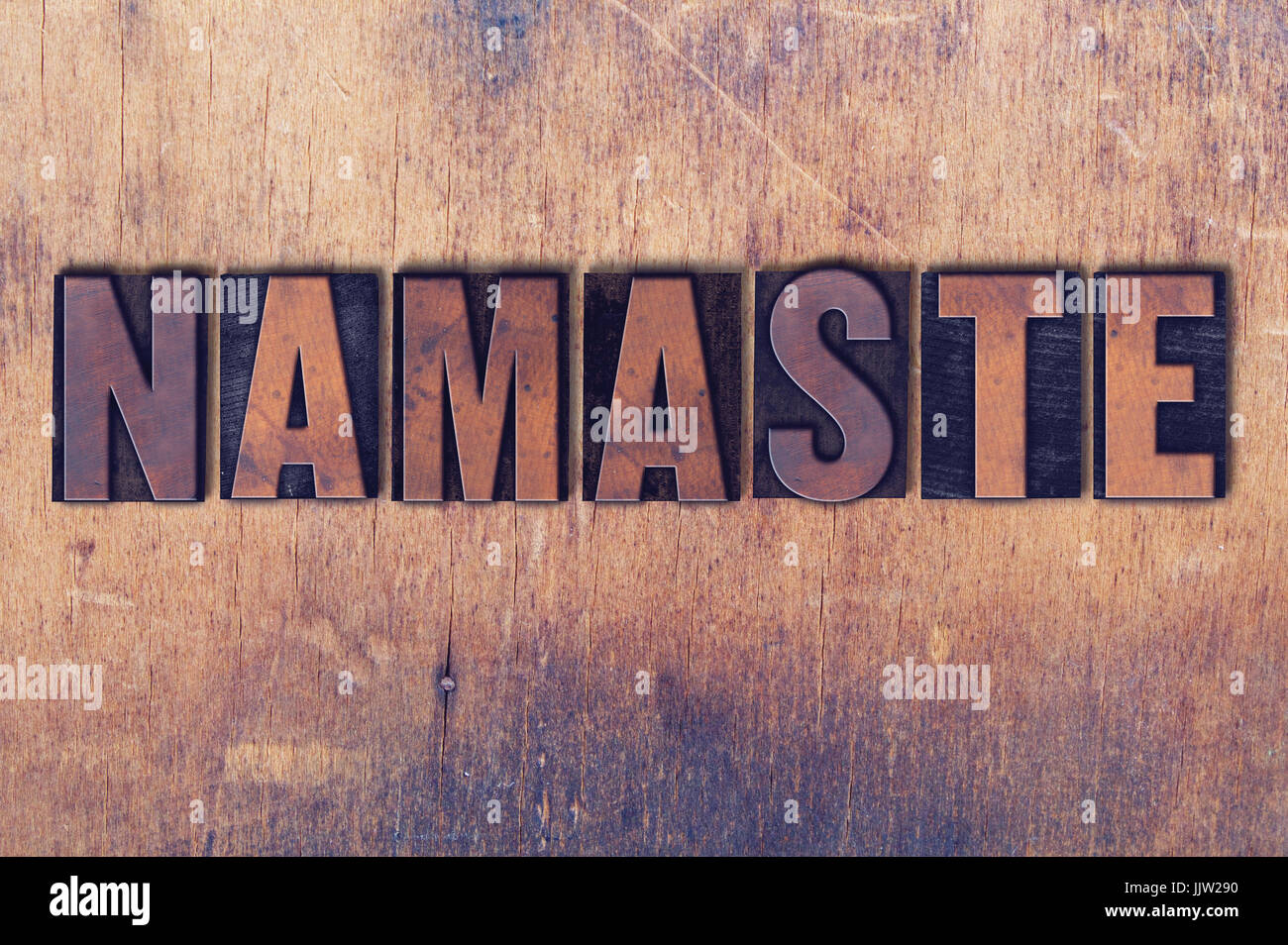 The word Namaste concept and theme written in vintage wooden ...