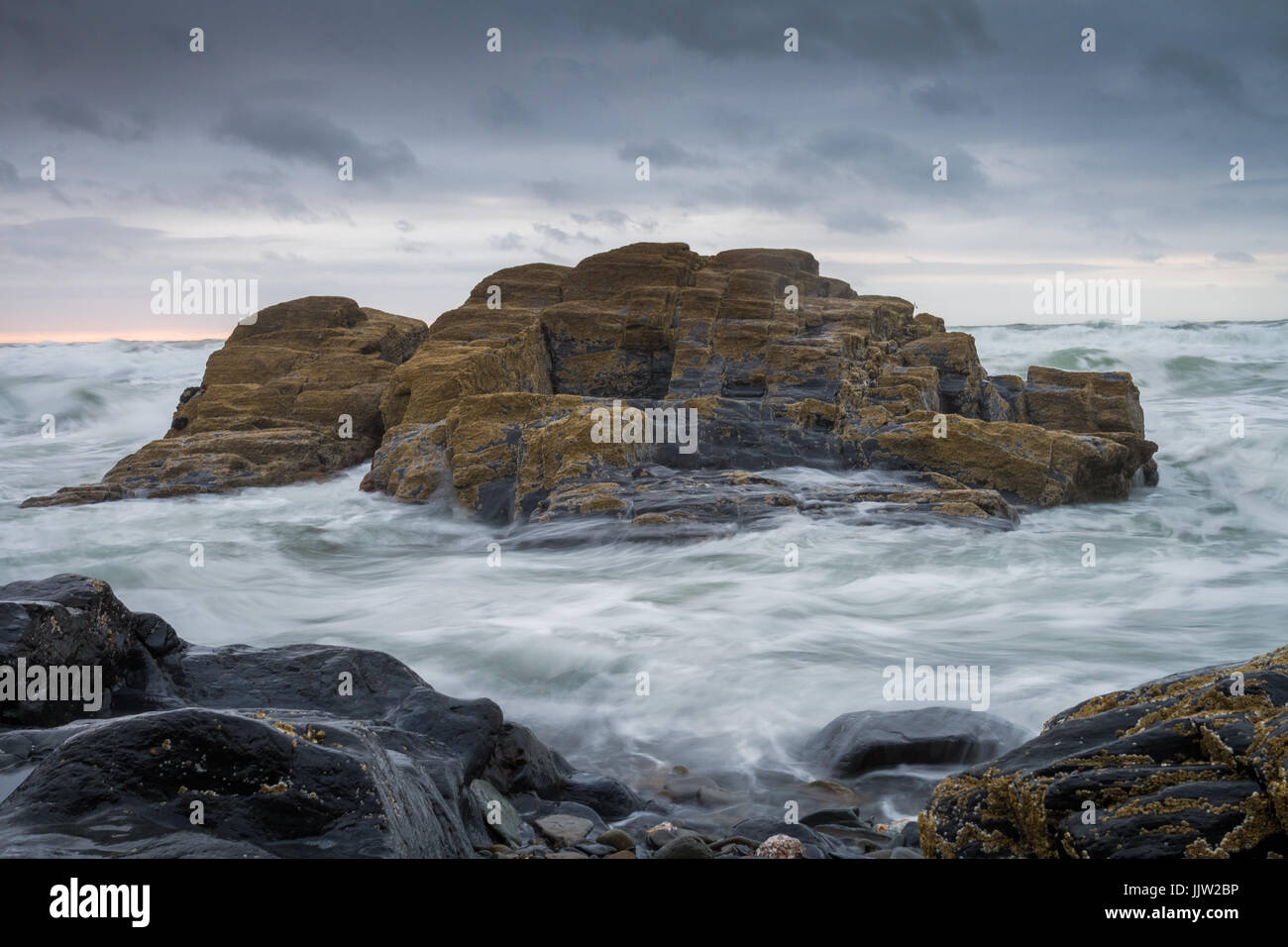 Rock formation in a stormy Sea Stock Photo - Alamy