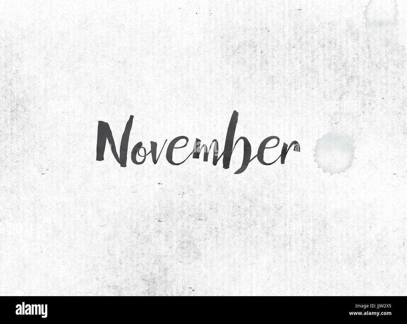 The word November concept and theme painted in black ink on a ...