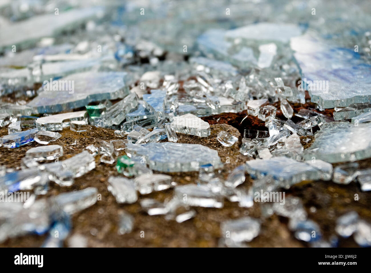 Shattered glass on the ground Stock Photo - Alamy