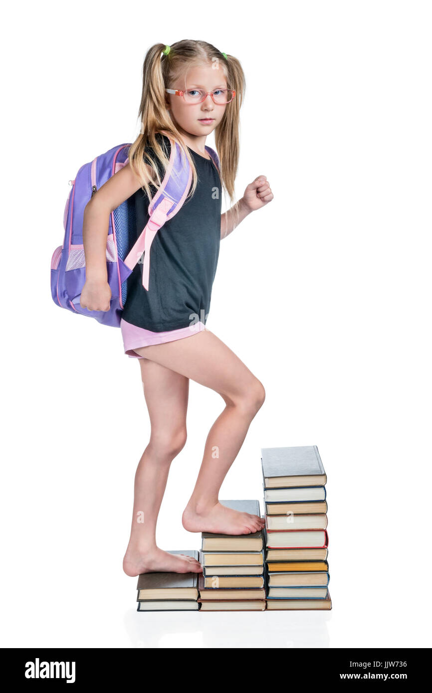 Girl steps on the stairs from books Stock Photo - Alamy
