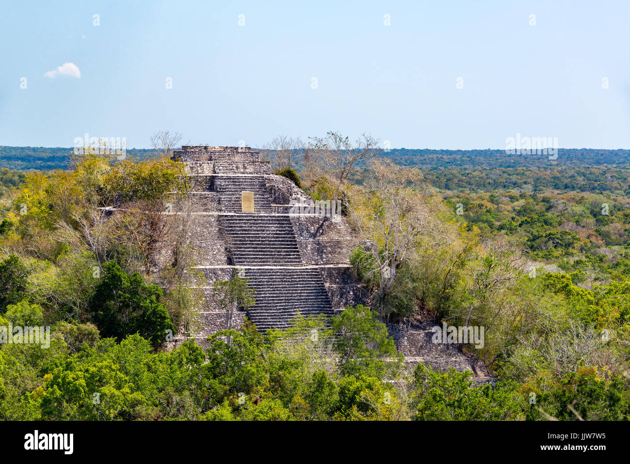 View of the pyramid known as structure one rising above the rain forest ...