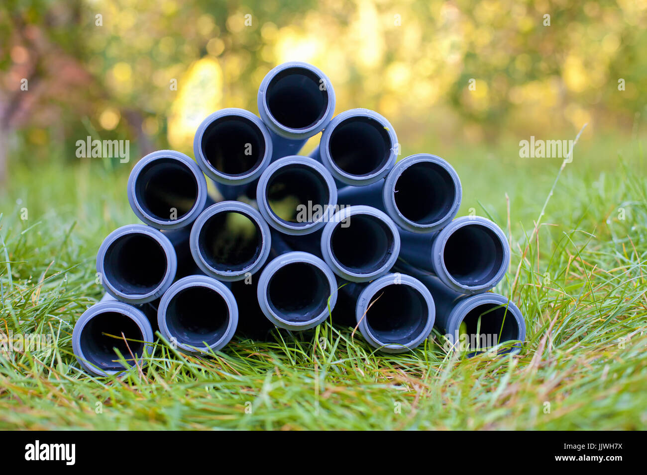 Stacked plastic pipes hi-res stock photography and images - Alamy
